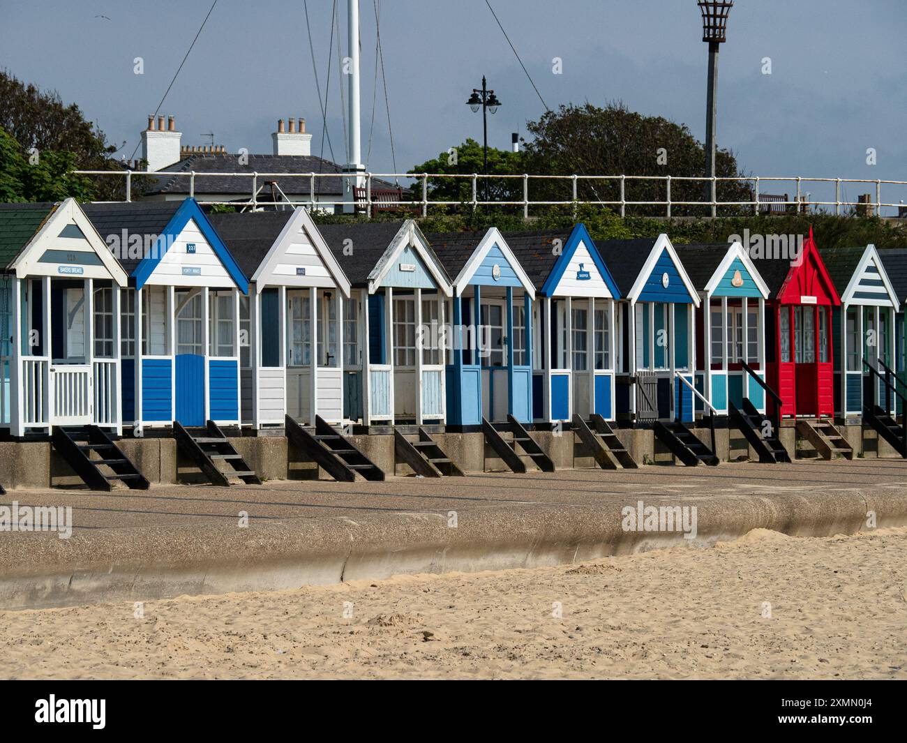 The iconic multi coloured beach huts along the sea front in Southwold ...
