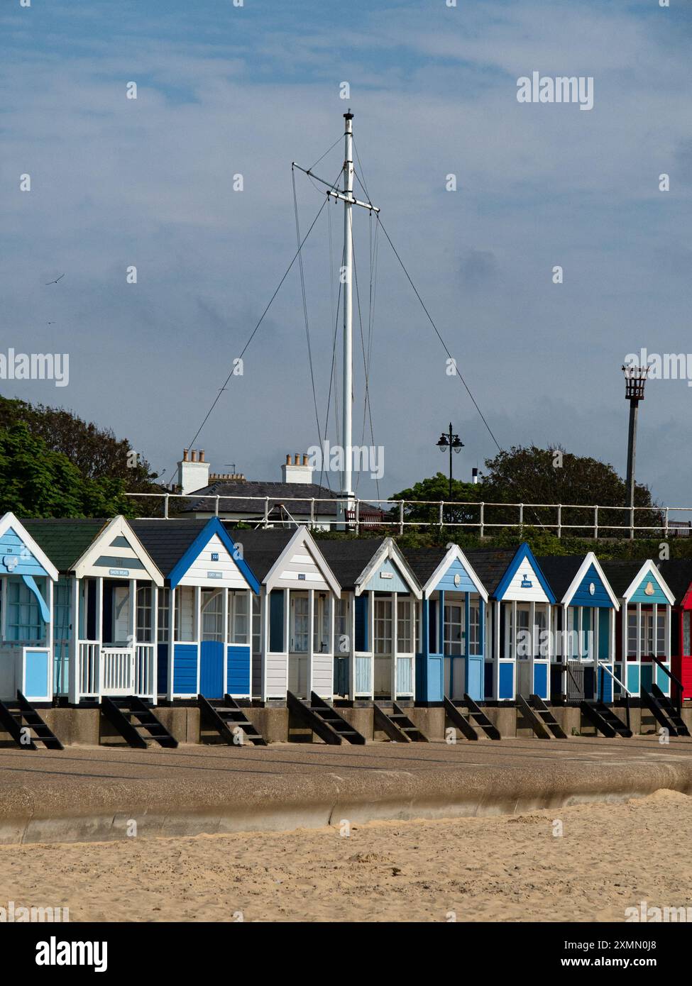 The iconic multi coloured beach huts along the sea front in Southwold ...