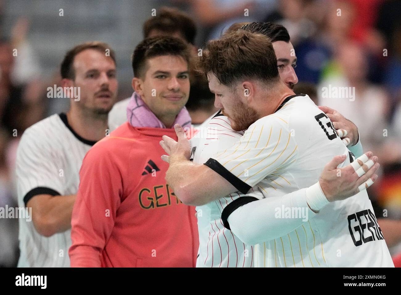 Germany team reacts after winning against Japan during a men's handball ...