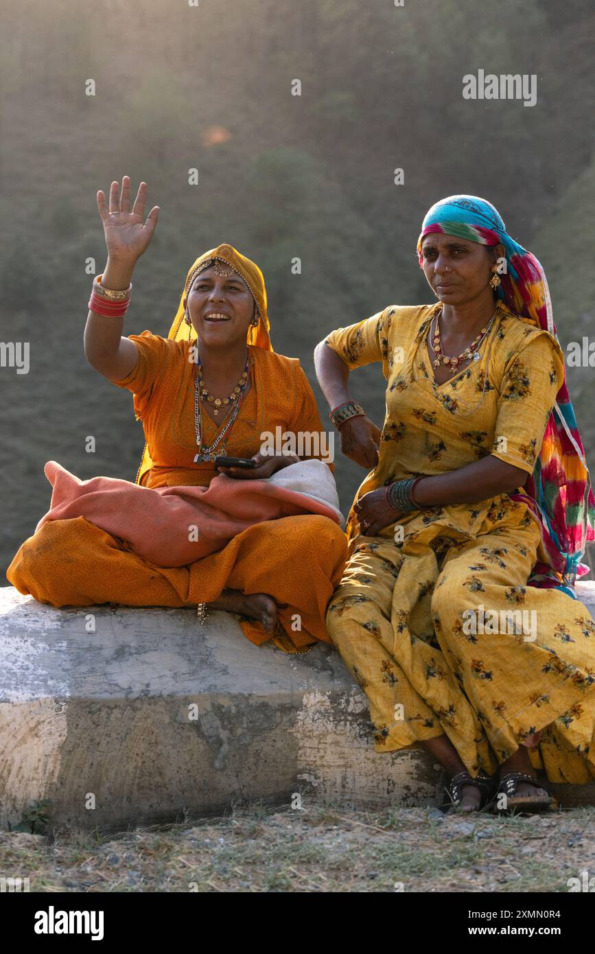 MANALI, INDIA - 21 JUNE 2024: Indian women in bright clothing sit by ...