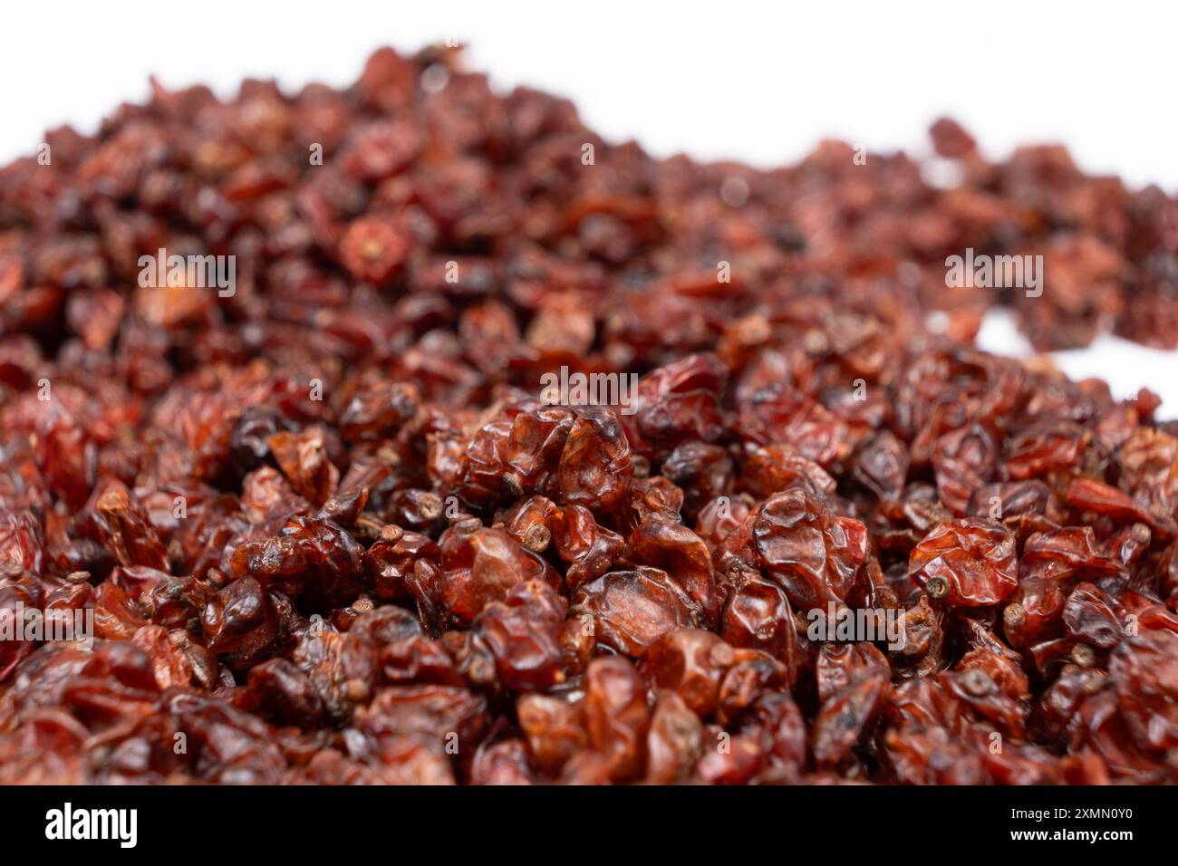 Red dried barberry on white background Stock Photo - Alamy