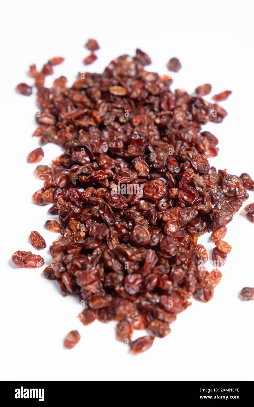 Red dried barberry on white background Stock Photo - Alamy