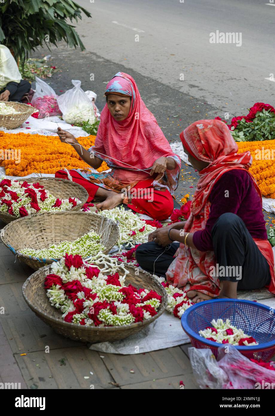 Women selling garlands of flowers at flower market, Dhaka Division ...