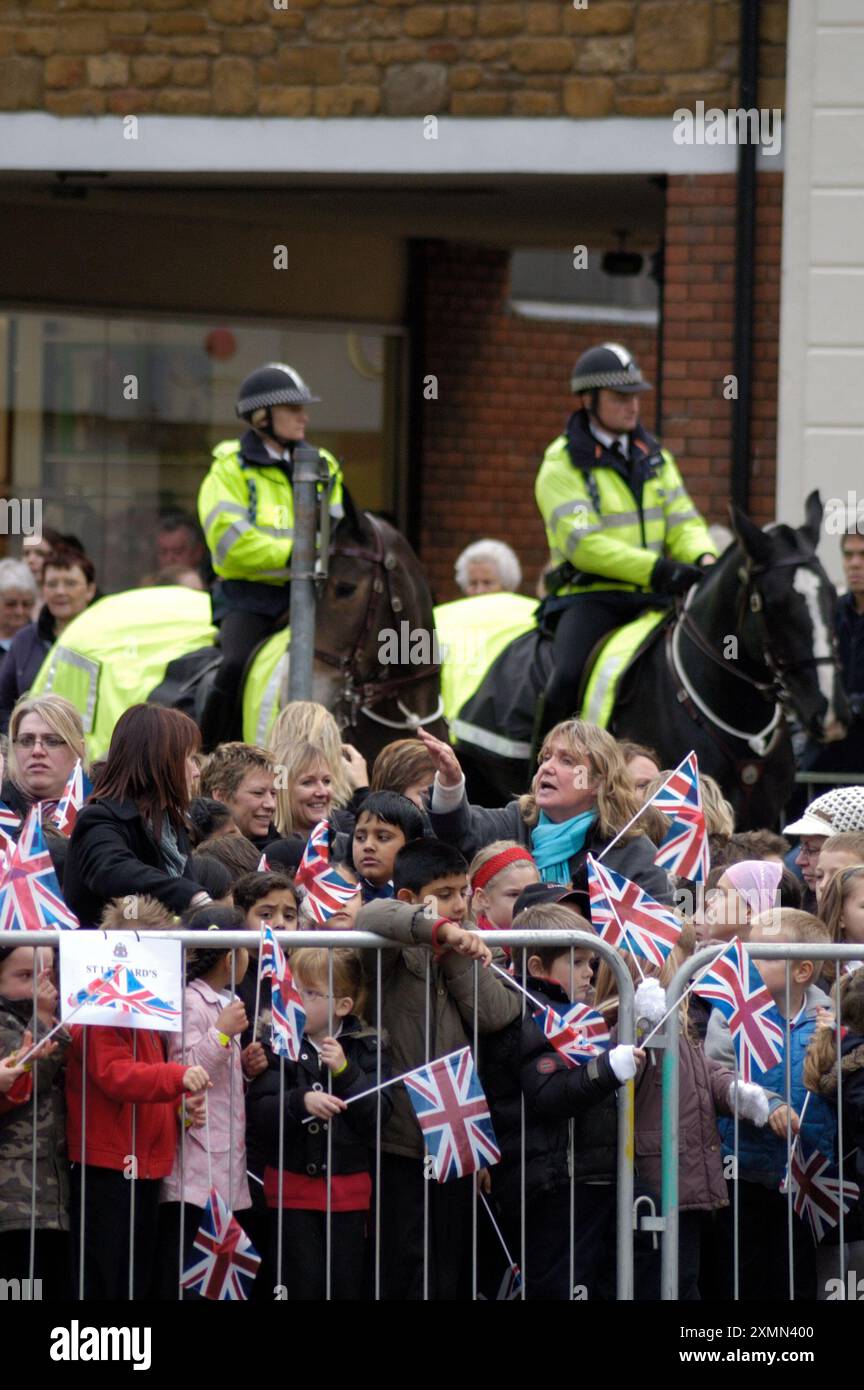 School Children waiting for the Queen to pass on her walk around ...