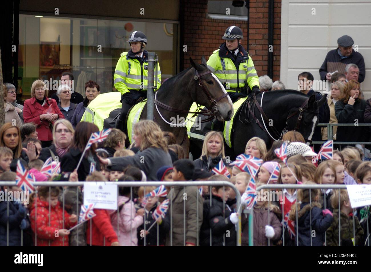 School Children waiting for the Queen to pass on her walk around ...