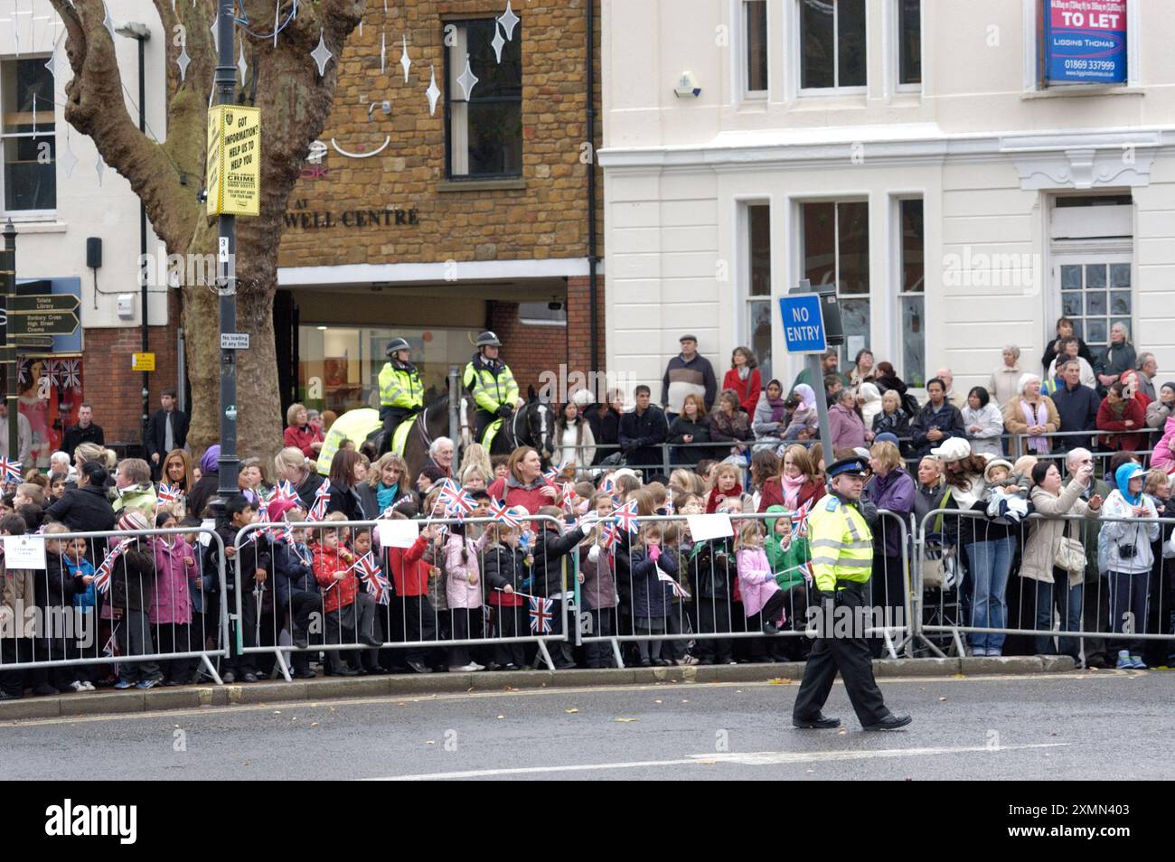 School Children waiting for the Queen to pass on her walk around ...