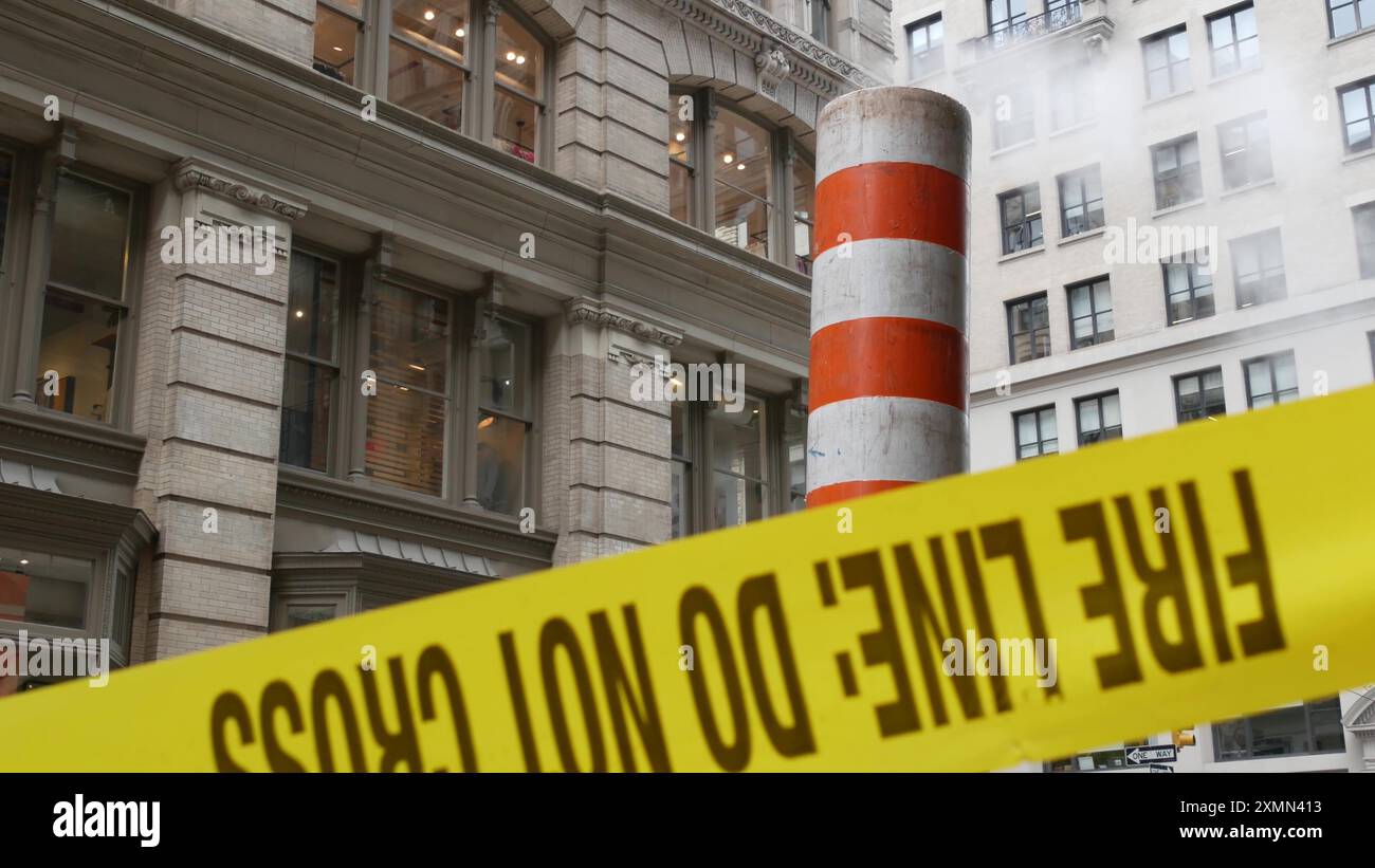 Steam vapor vented on New York City street, orange vapour tube stack ...