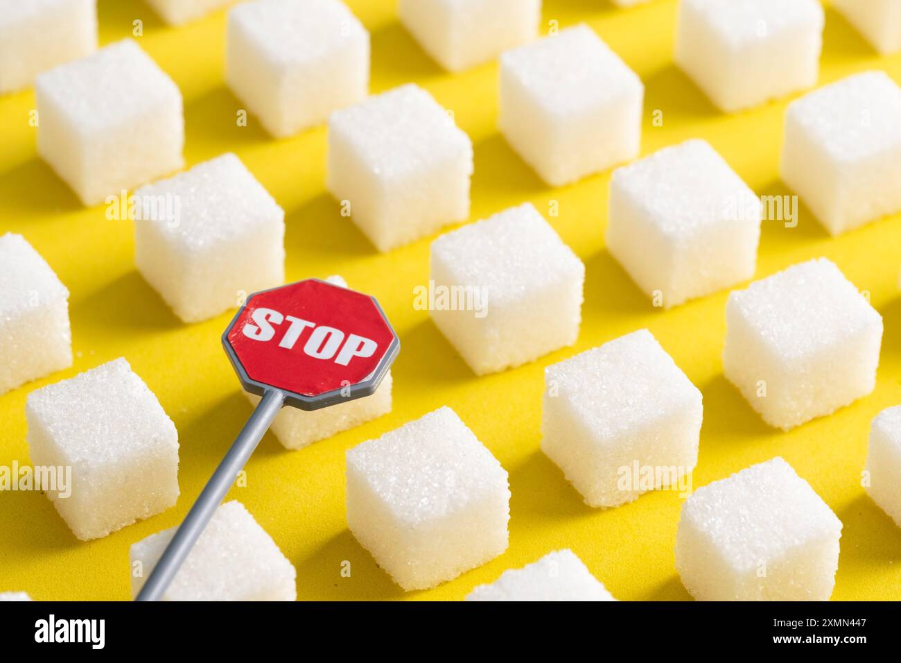 Sugar cubes and stop sign on yellow background, conceptual image Stock ...