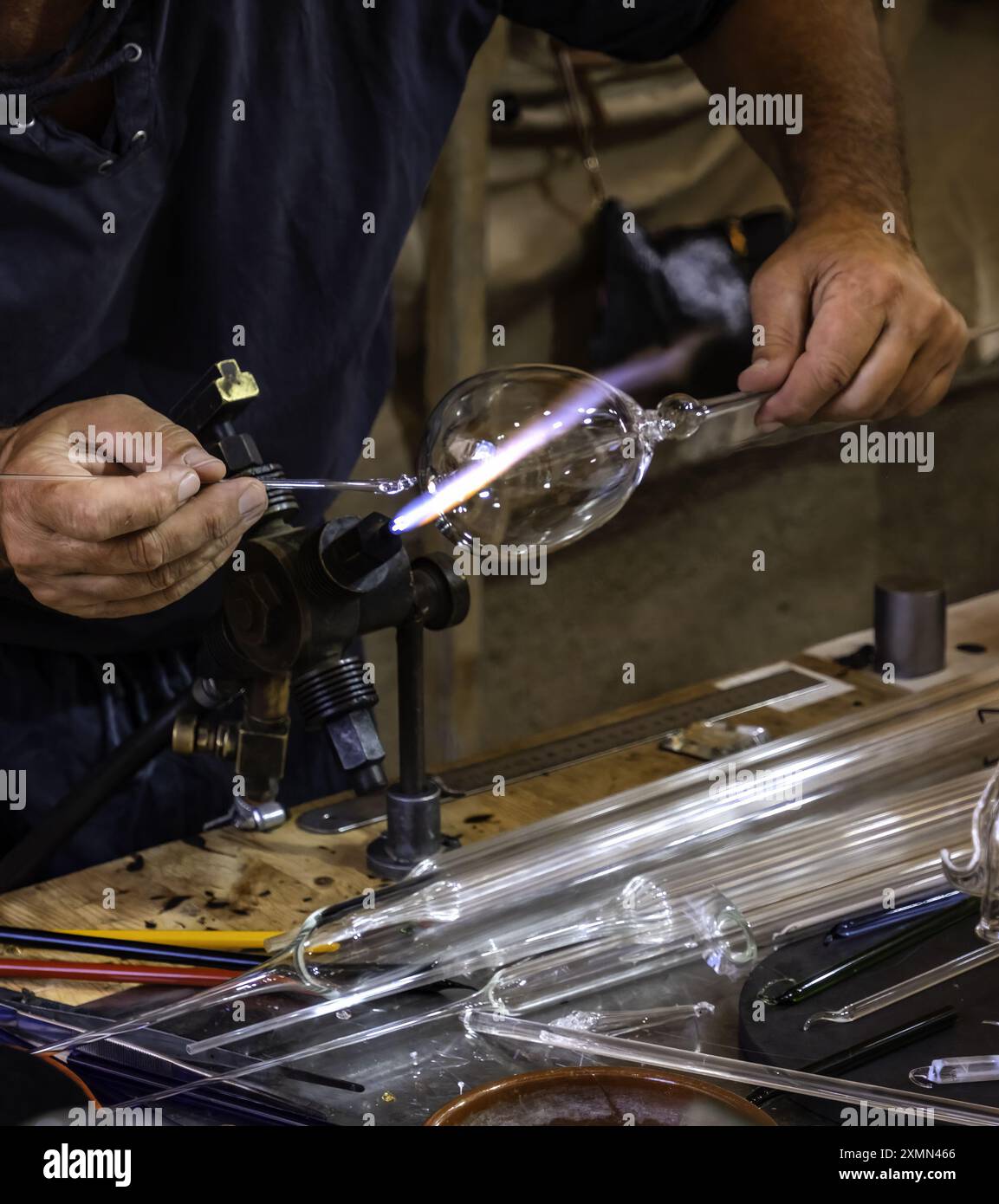 Detail of a glass craftsman, shaping glass with fire Stock Photo - Alamy