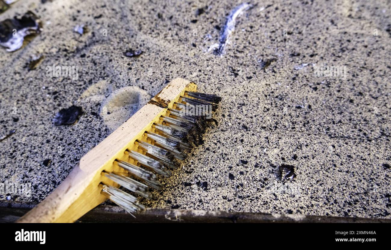 Detail of tool for scraping and cleaning dirt on metal Stock Photo - Alamy