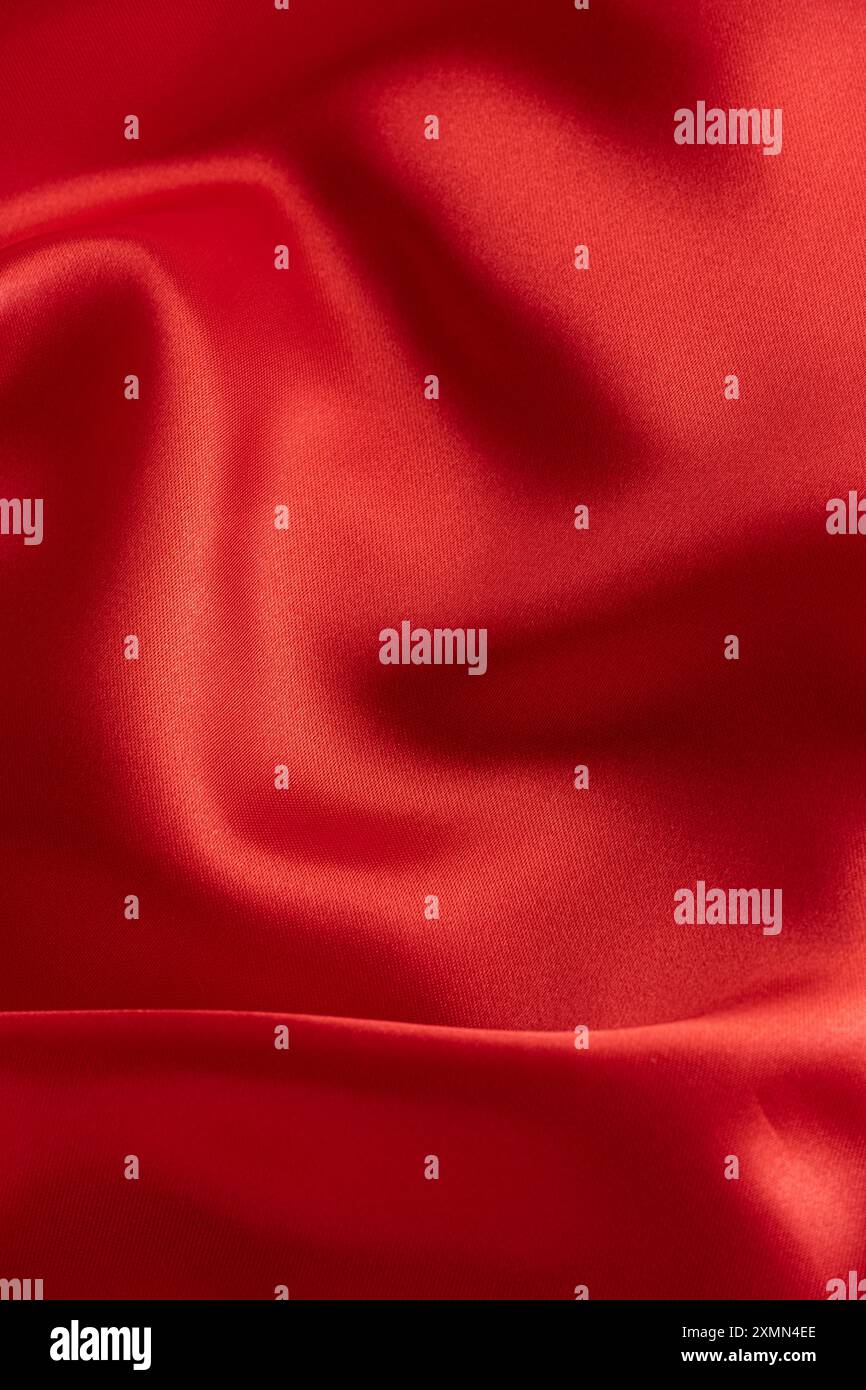 Closeup of rippled red satin fabric texture background Stock Photo - Alamy