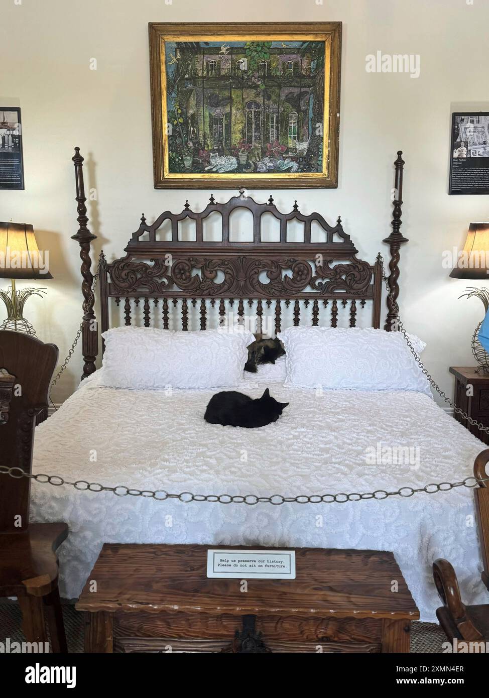 Cats lie on Ernest Hemingway's bed inside Hemingway House museum in Key ...