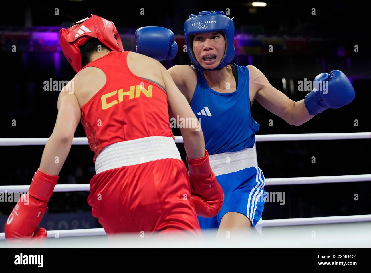 China's Yang Wenlu, right, fights Vietnam's Thi Linh Ha in their women ...