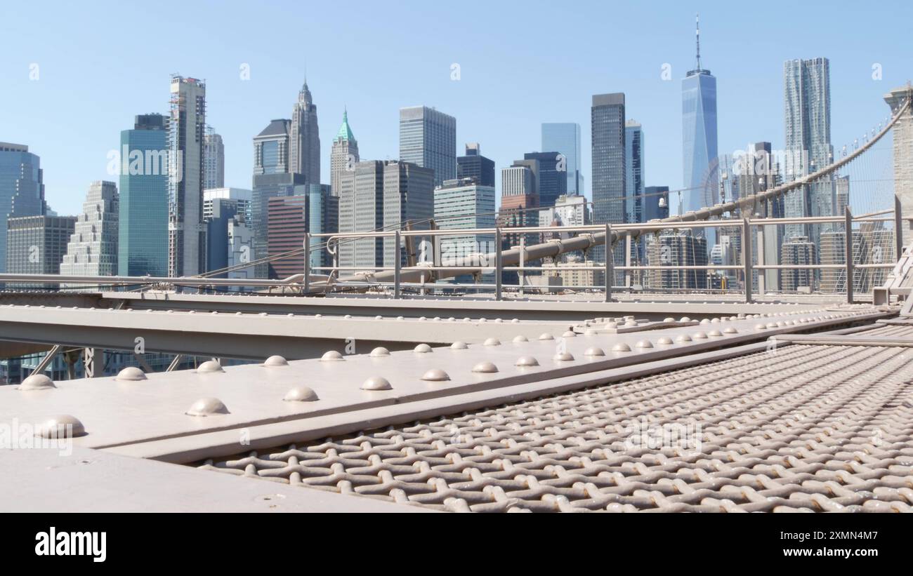 Brooklyn Bridge to Manhattan downtown. New York City skyline, financial ...