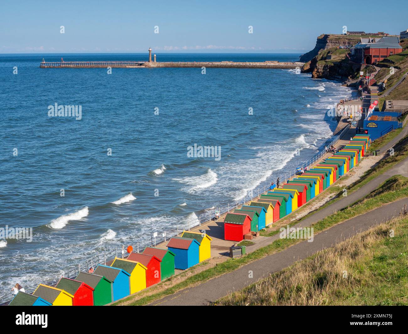 Colourful beach huts on the seafront at Whitby Stock Photo - Alamy