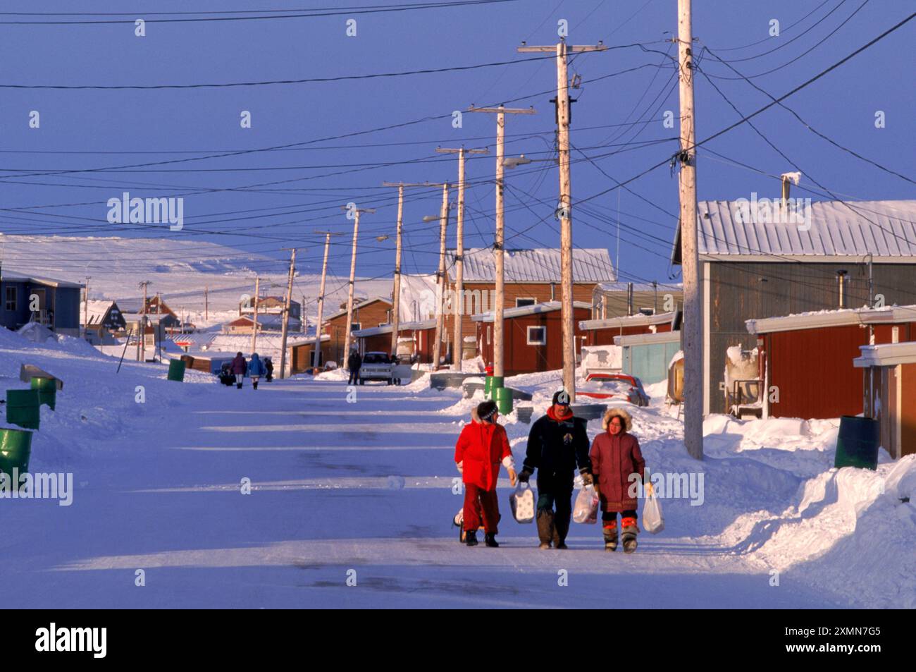 Pedestrians walk the streets of Igloolik, Nunavut, Canada Stock Photo ...