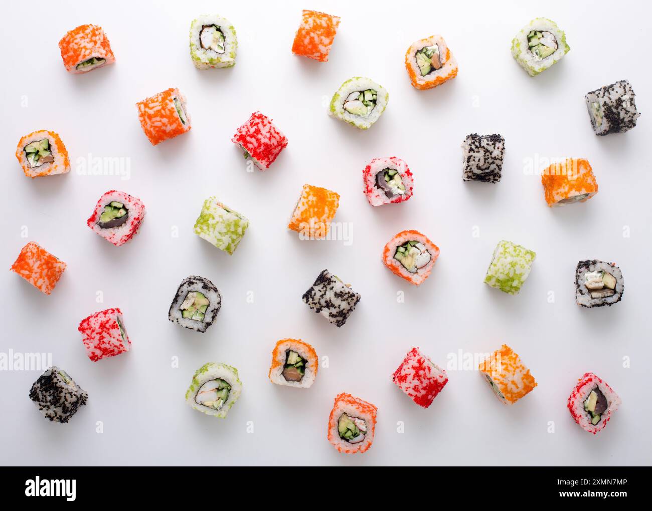 Top view on japanese sushi rolls, maki pattern on white background ...