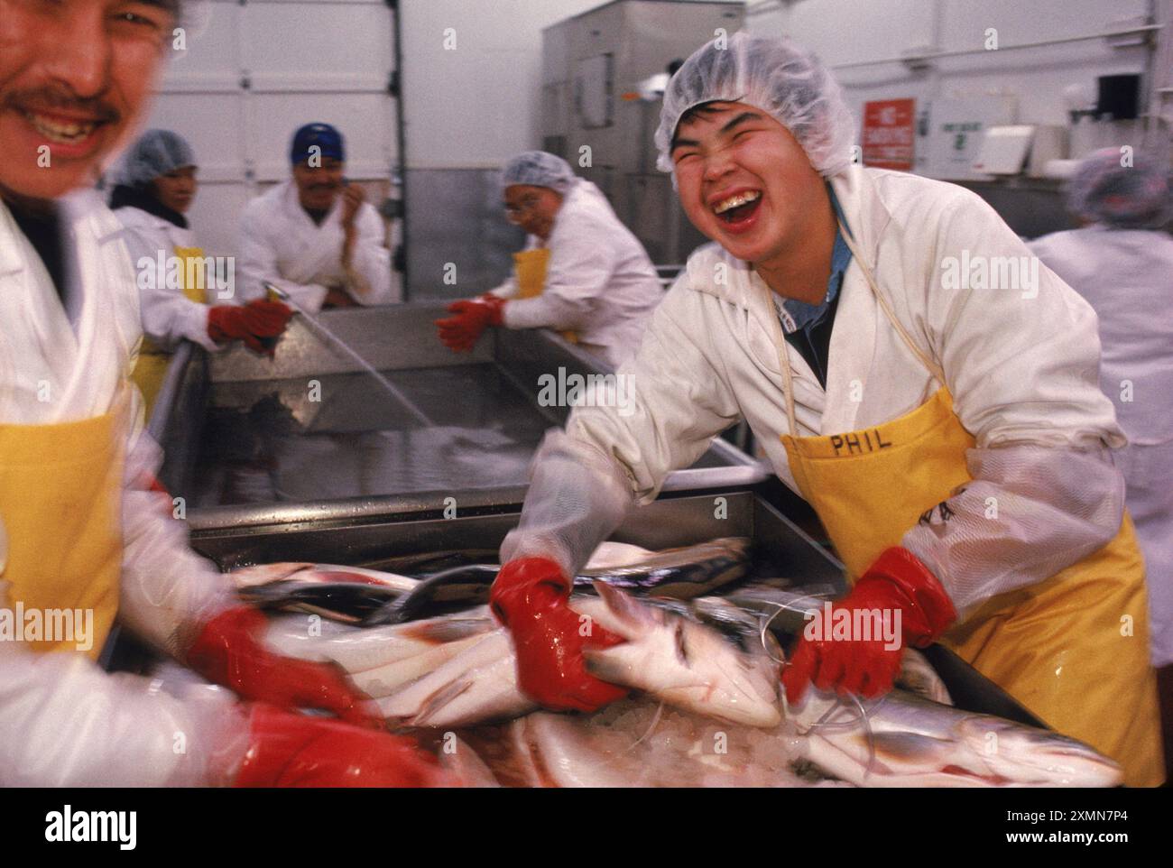 Workers laugh at fish plant, Nunavut, Canada Stock Photo - Alamy