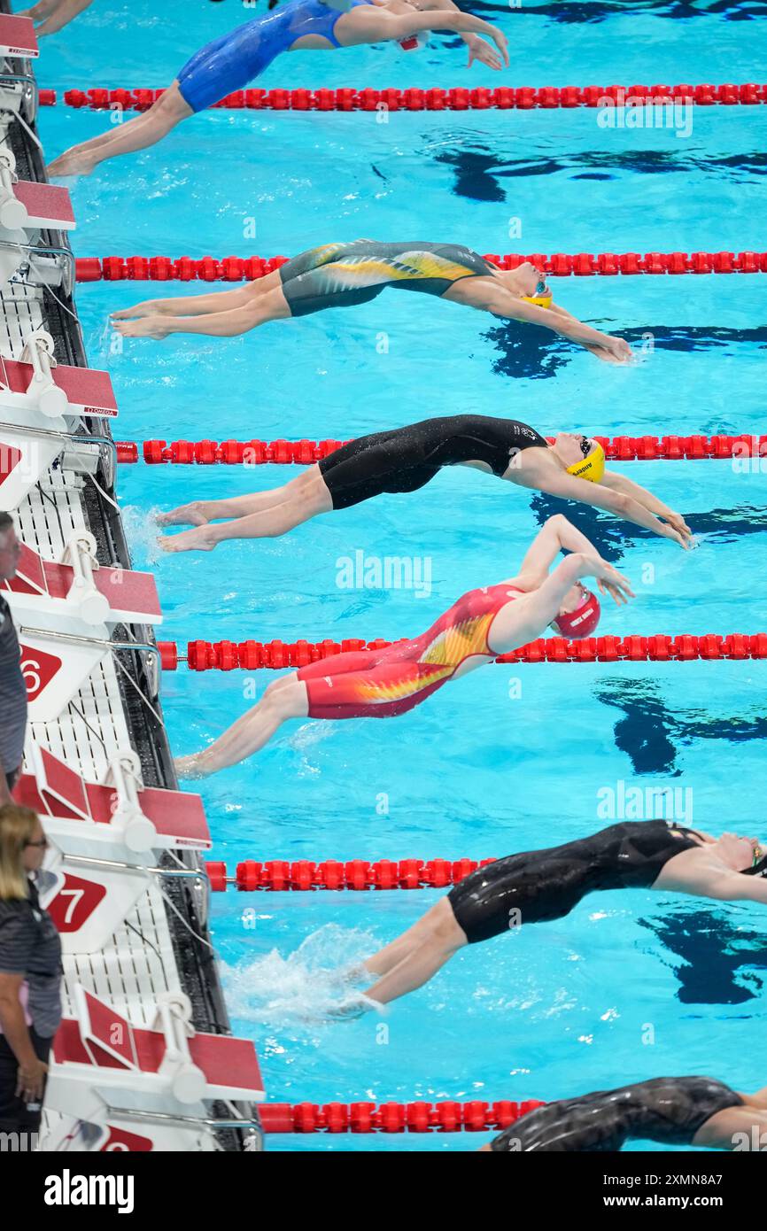 Swimmers compete during a heat in the women's 100-meter backstrokeat ...