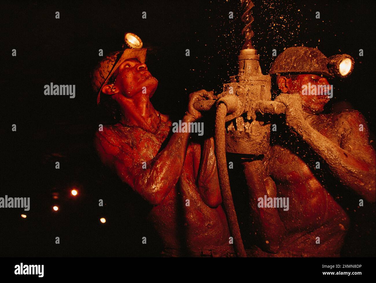 Miners in India drill to set a dynamite charge Stock Photo - Alamy