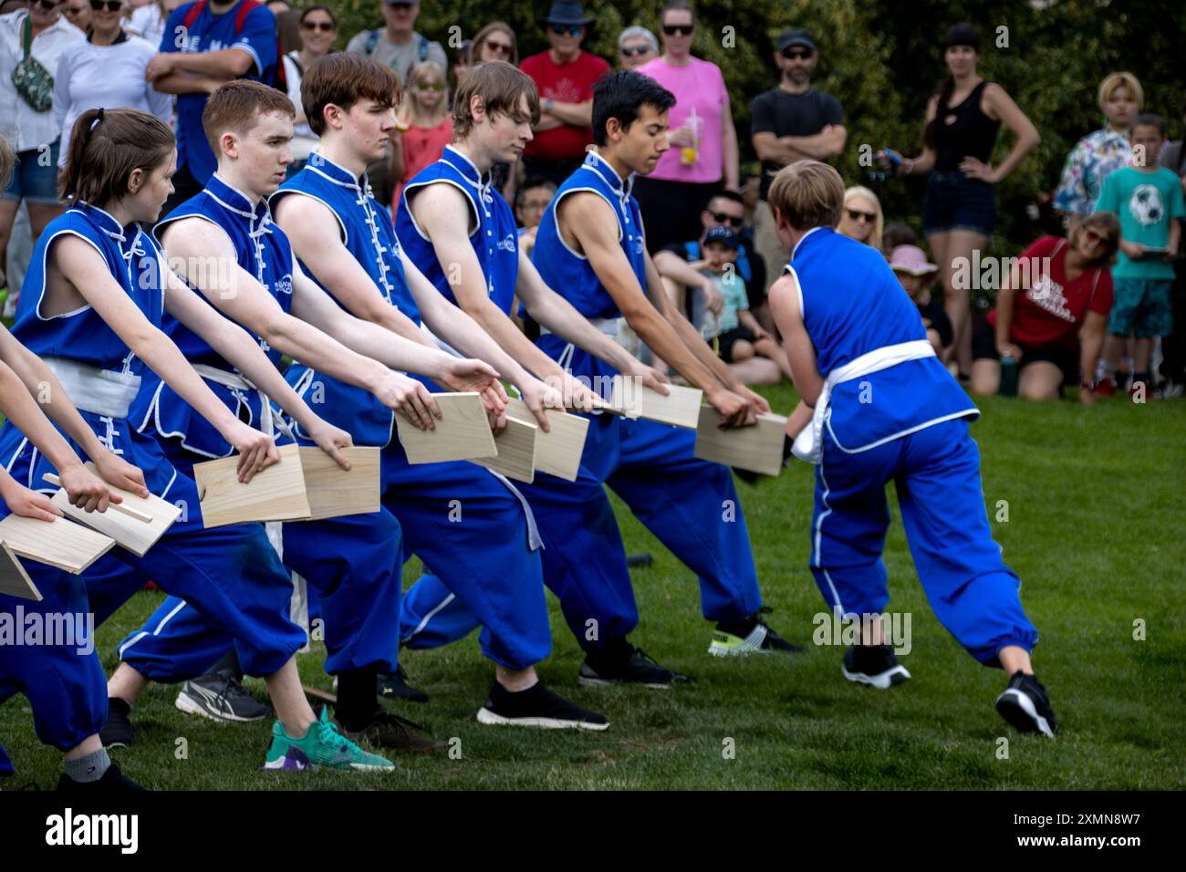 Group of kids demonstrating kung fu in blue uniforms outdoors Stock ...