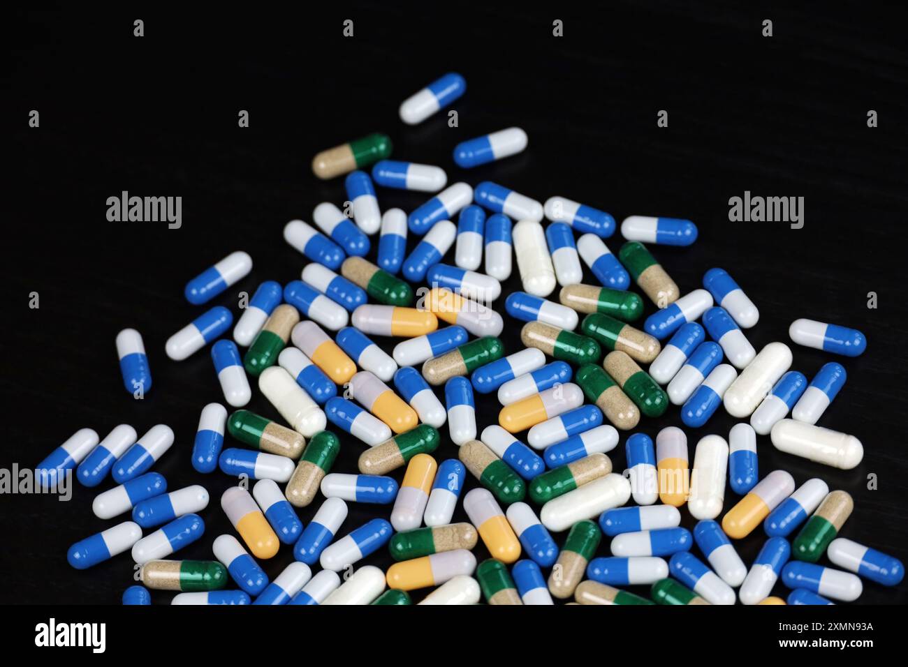 Blue white and green gray pills, variation of medication in capsules ...