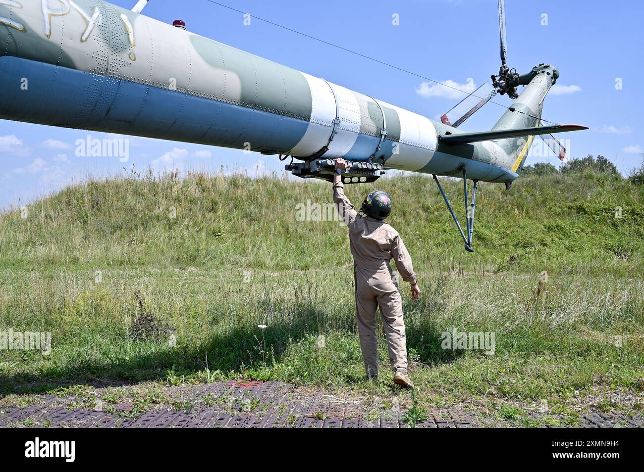 UKRAINE - JULY 11, 2024 - A flight engineer checks the systems of a Mi ...