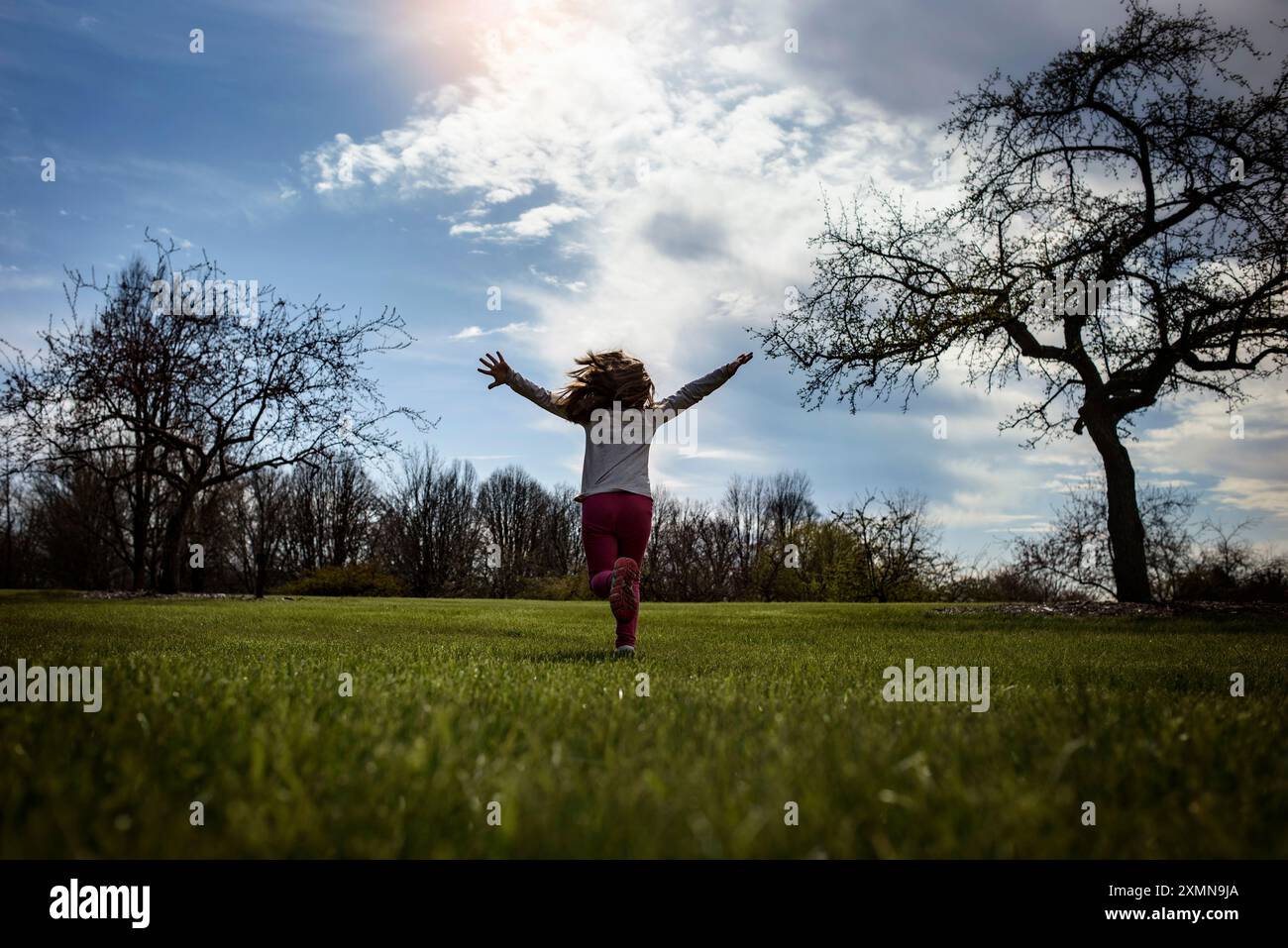 Child running through the field hi-res stock photography and images - Alamy