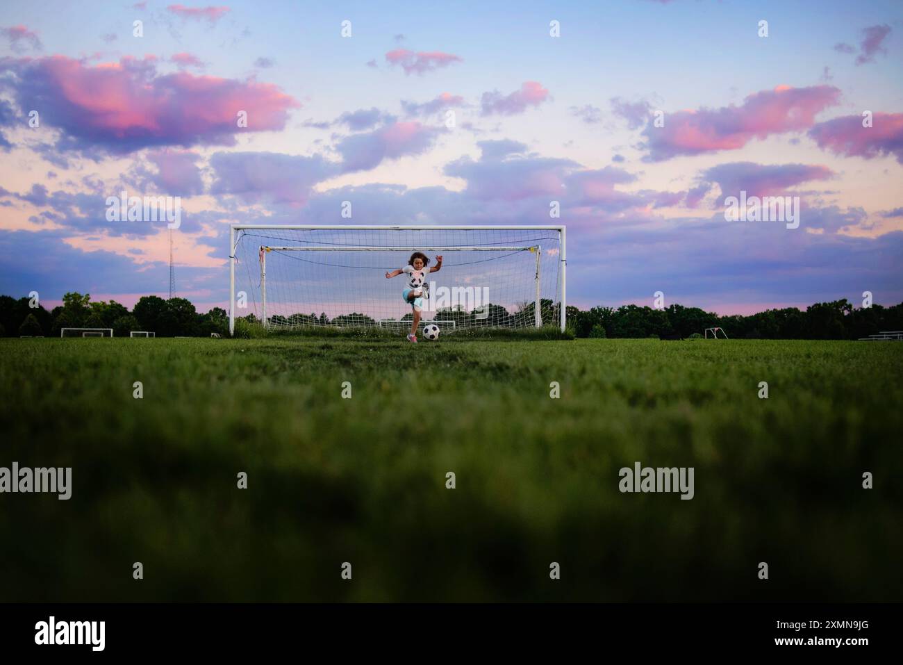 Soccer ball kick girl hi-res stock photography and images - Alamy