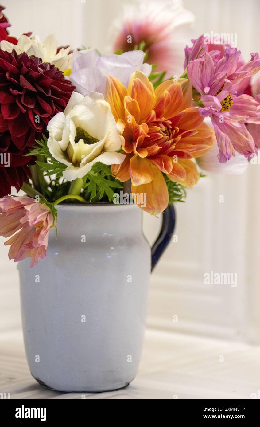 Colorful bouquet of flowers in a white vintage jug Stock Photo - Alamy