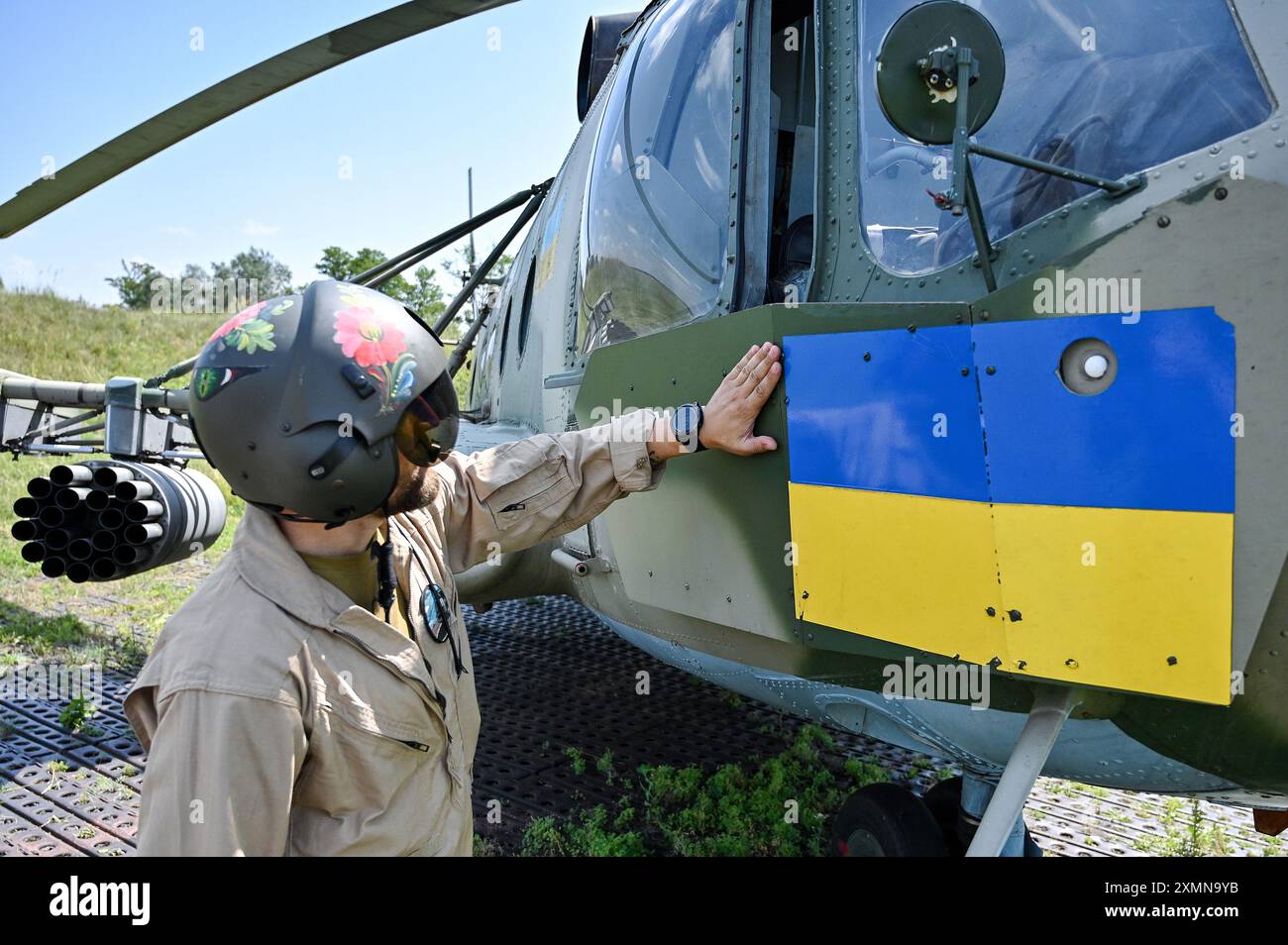 UKRAINE - JULY 11, 2024 - A flight engineer checks the systems of a Mi ...