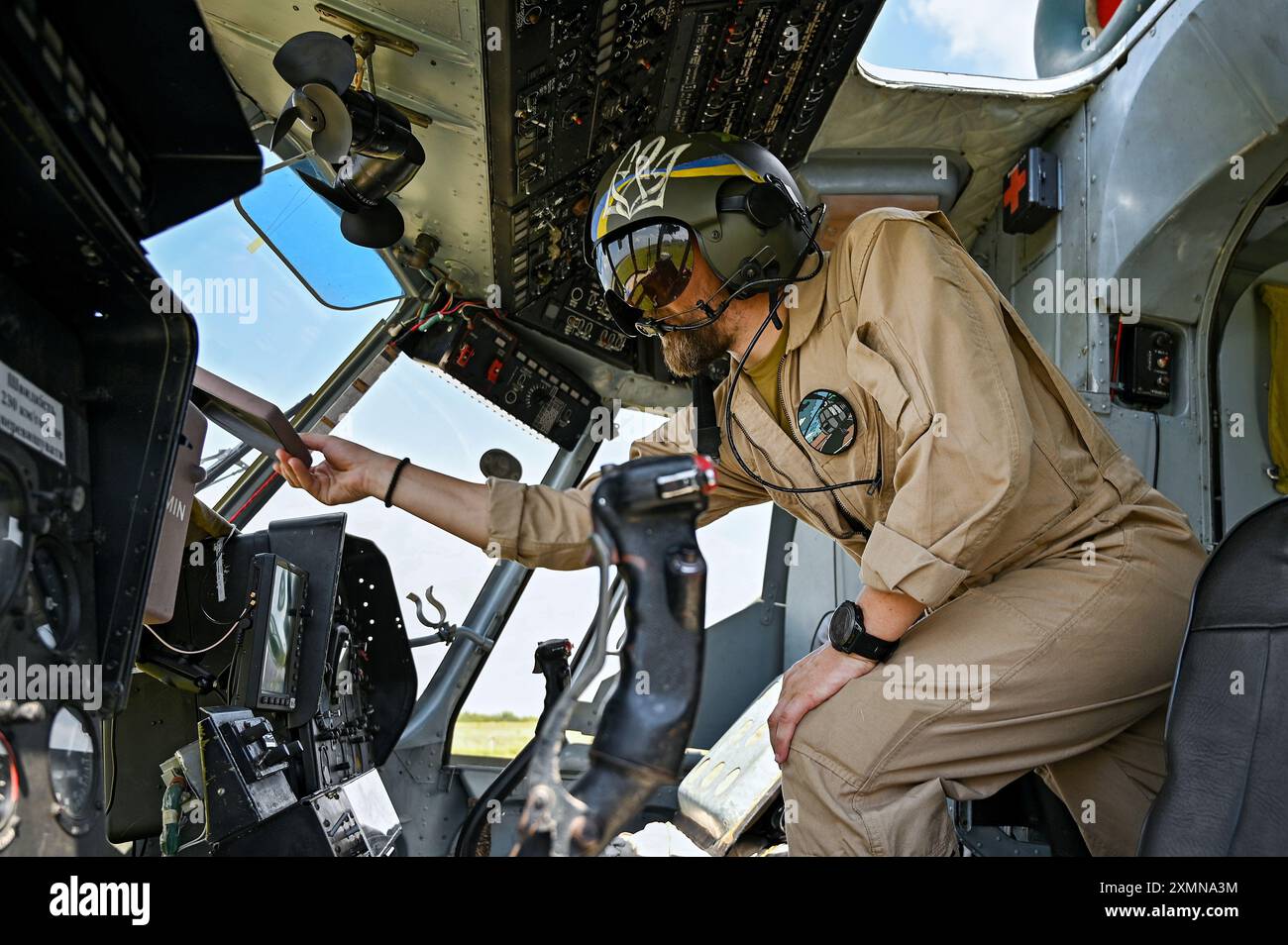 UKRAINE - JULY 11, 2024 - A flight engineer checks the systems of a Mi ...