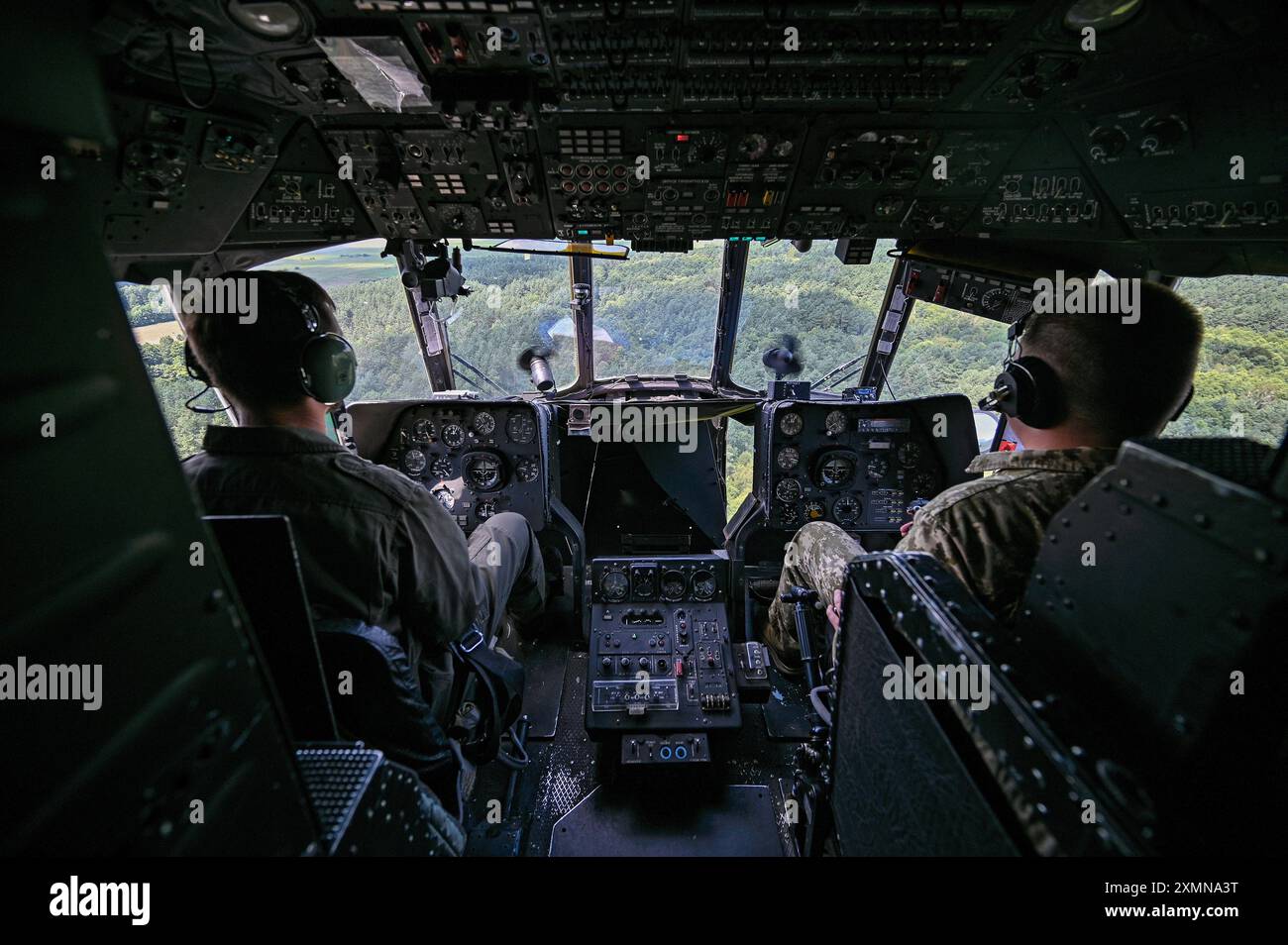 UKRAINE - JULY 11, 2024 - Pilots are in the cockpit of a Mi-8MSB-V ...