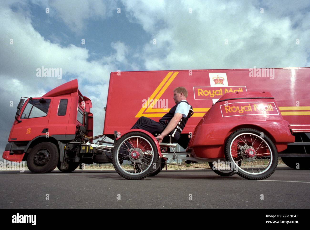 Postman on bicycle delivering mail hi-res stock photography and images ...