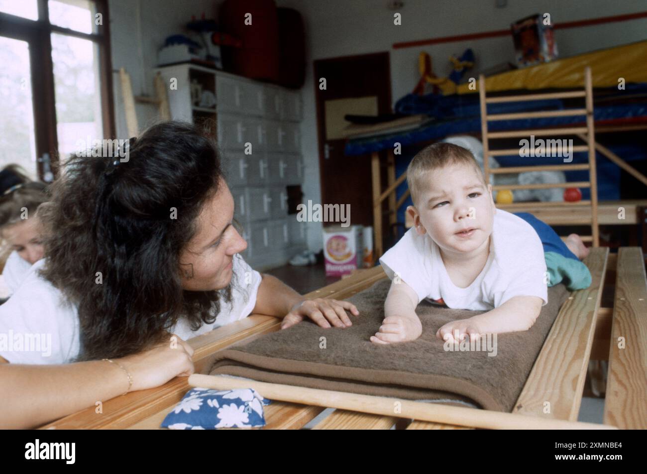 A carer and a patient at cerebral palsy therapy centre The Rainbow ...