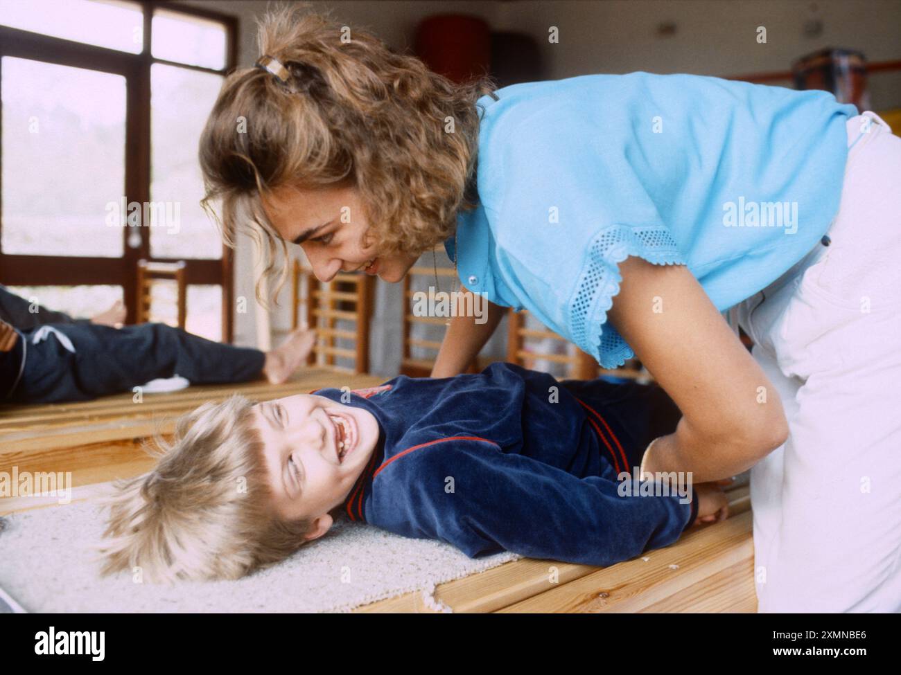A carer and a patient at cerebral palsy therapy centre The Rainbow ...