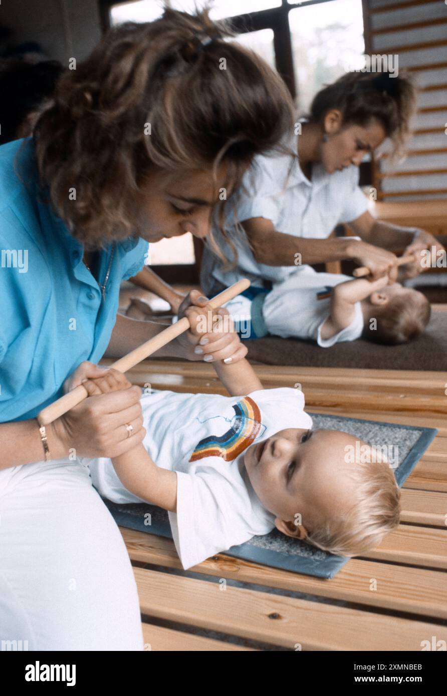 A carer and a patient at cerebral palsy therapy centre The Rainbow ...