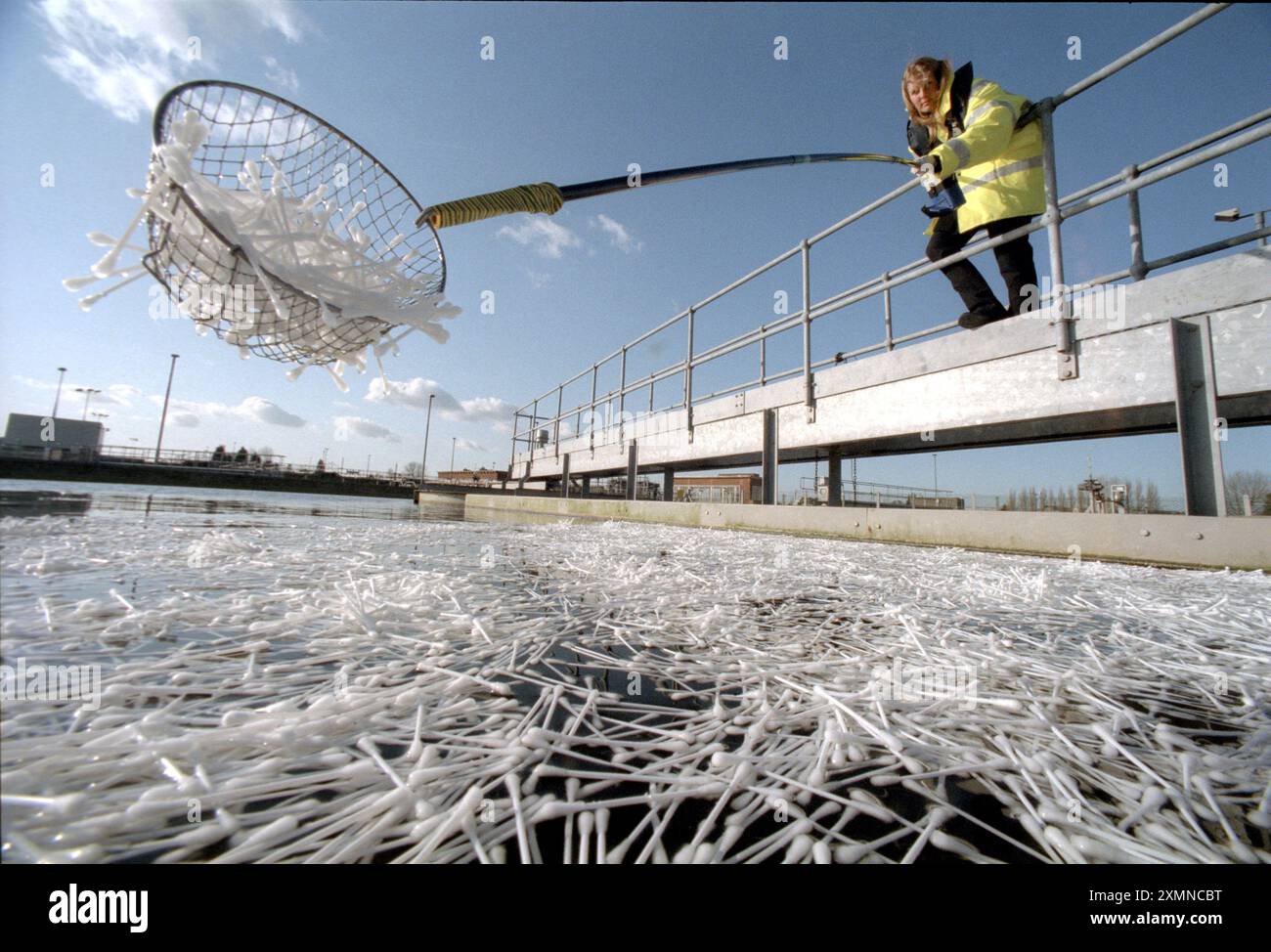 Thames Water A woman fishing cotton buds out of Oxford Sewage Treatment ...