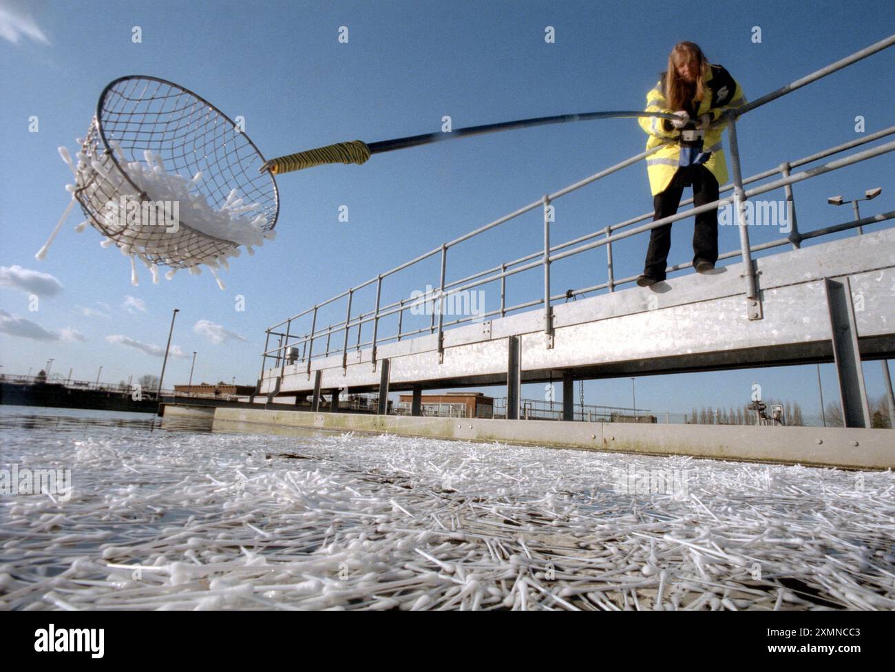 Thames Water A woman fishing cotton buds out of Oxford Sewage Treatment ...