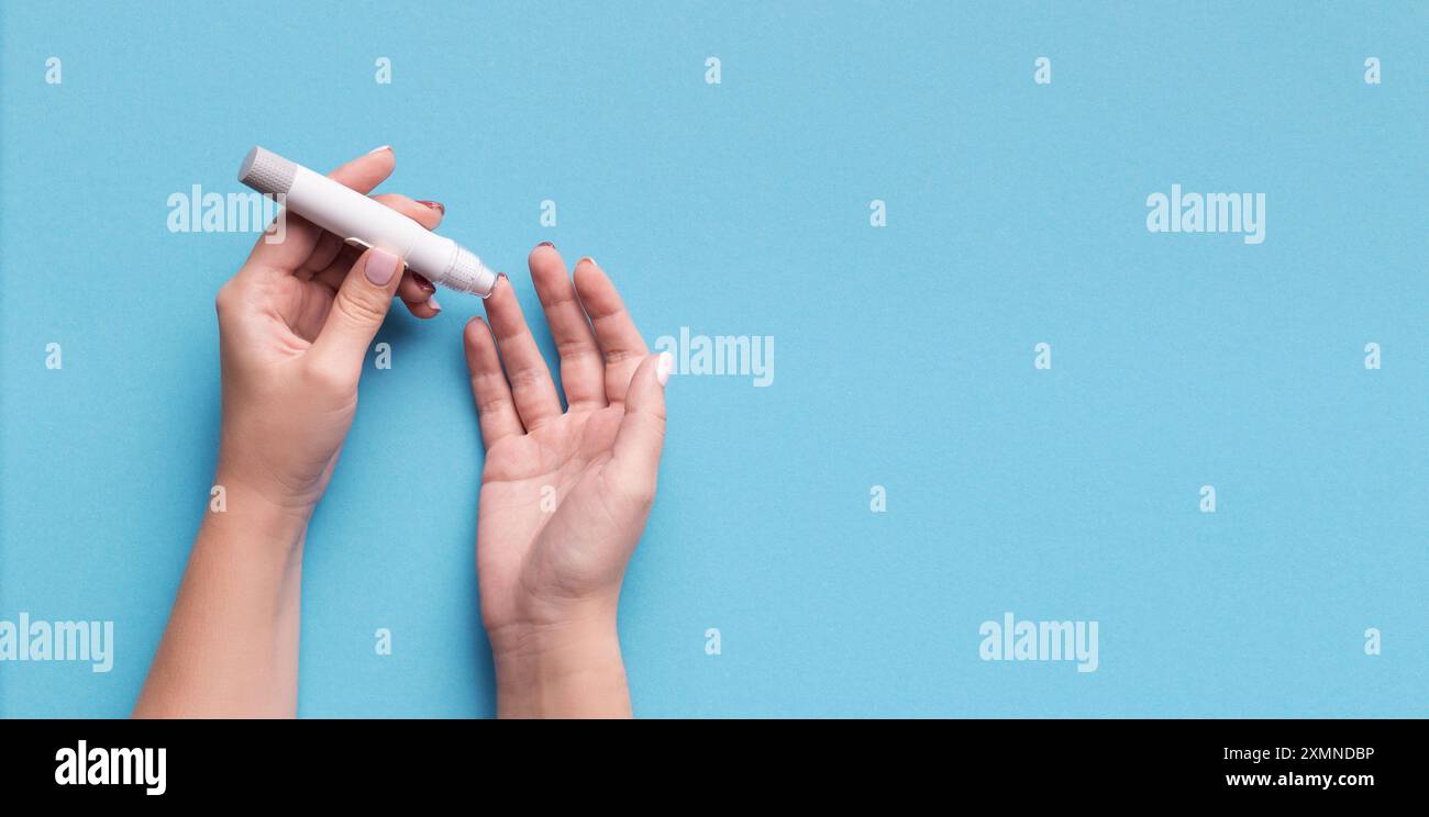 Woman using glucometer check hi-res stock photography and images - Alamy