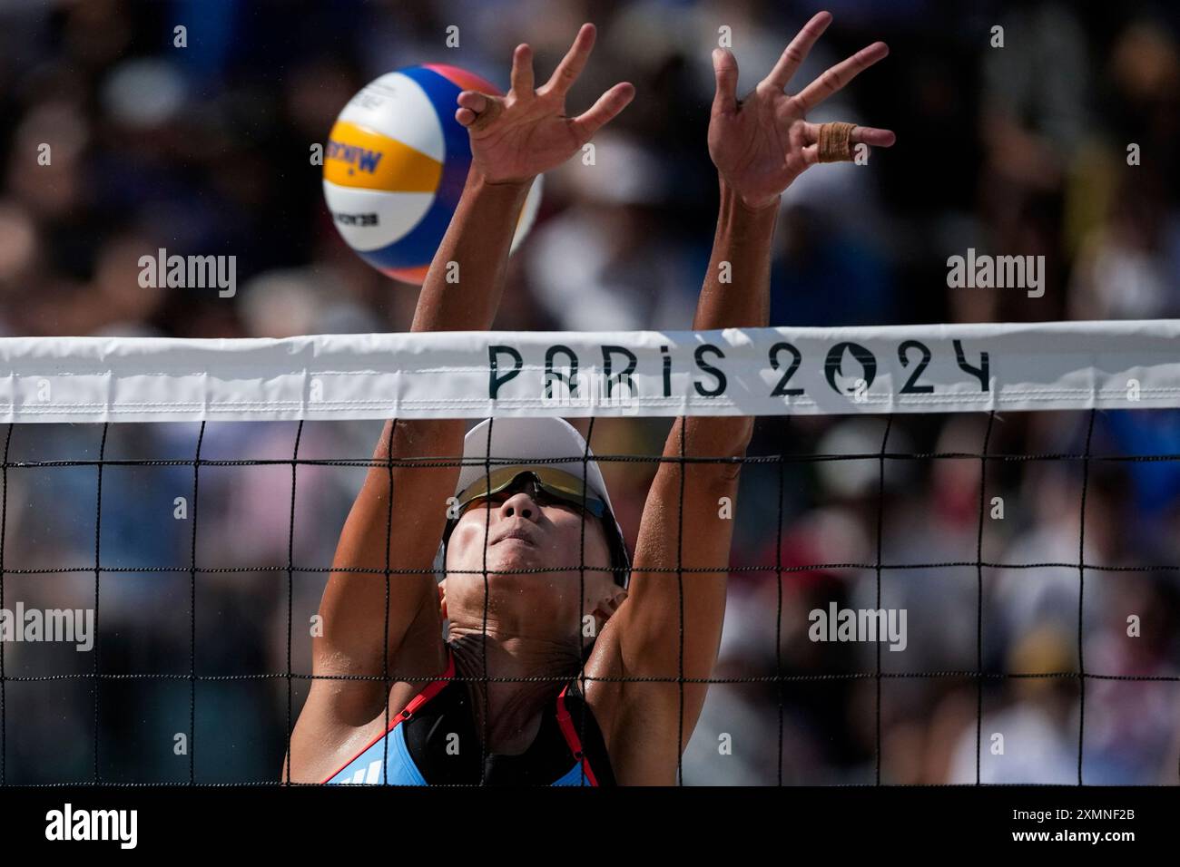 China's Xue Chen reaches for the ball during the women's pool B beach ...