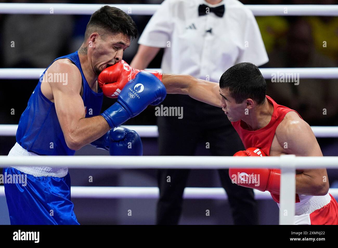 Uzbekistan's Ruslan Abdullaev hits Mexico's Miguel Angel Martinez in ...