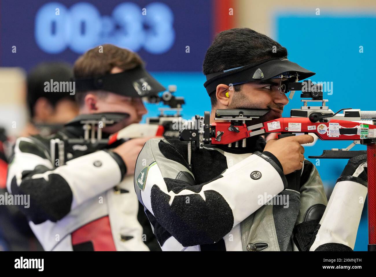 India's Arjun Babuta, right, competes in the 10m air rifle men's final ...