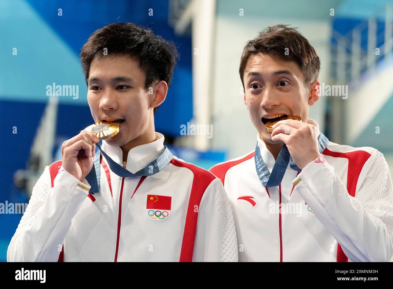 China's Lian Junjie and Yang Hao celebrate on the podium after winning ...