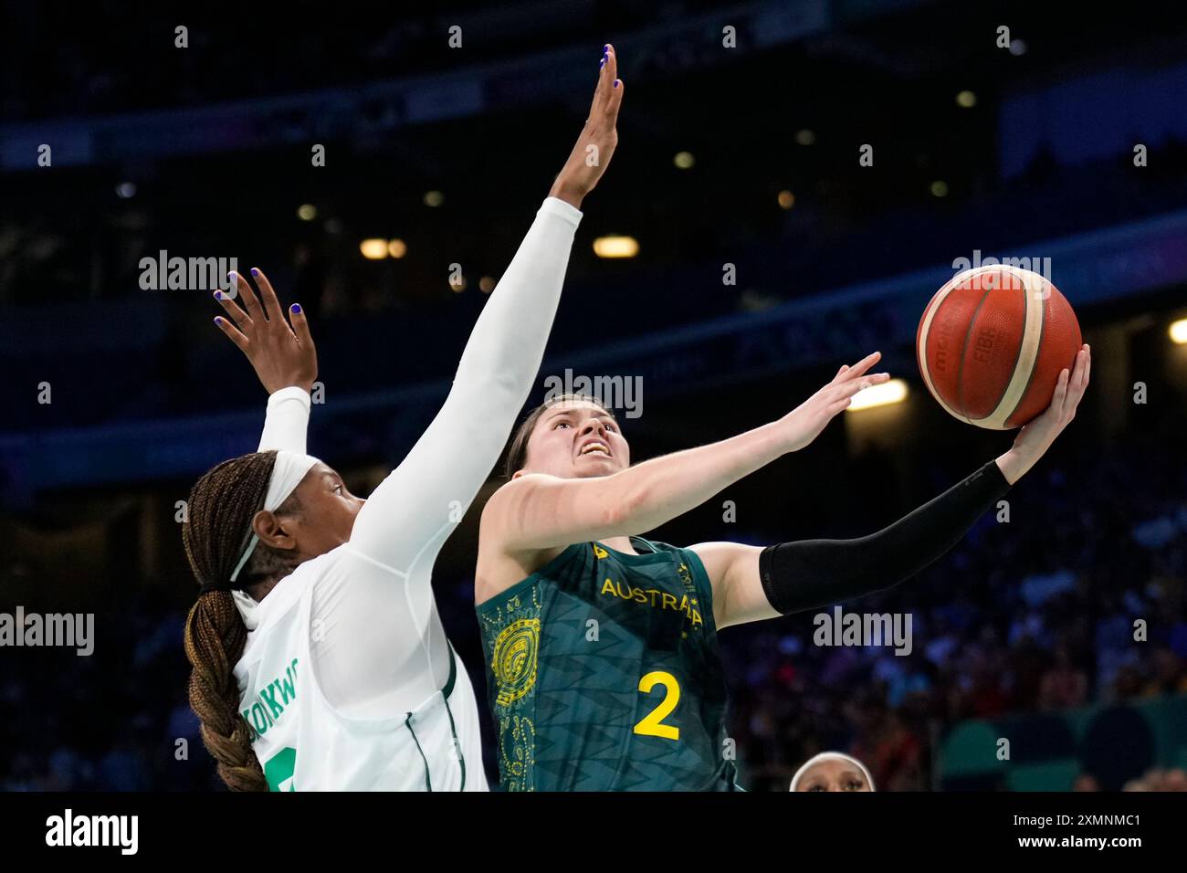 Jade Melbourne, of Australia, shoots around Amy Okonkwo, of Nigeria, in ...