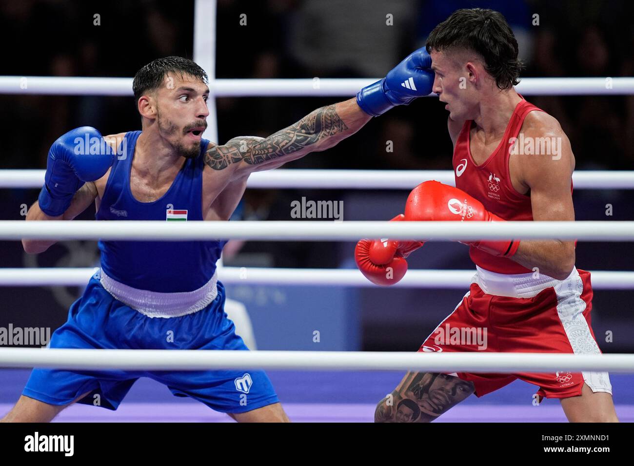 Hungary's Richard Kovacs hits Australia's Harry Garside in their men's ...