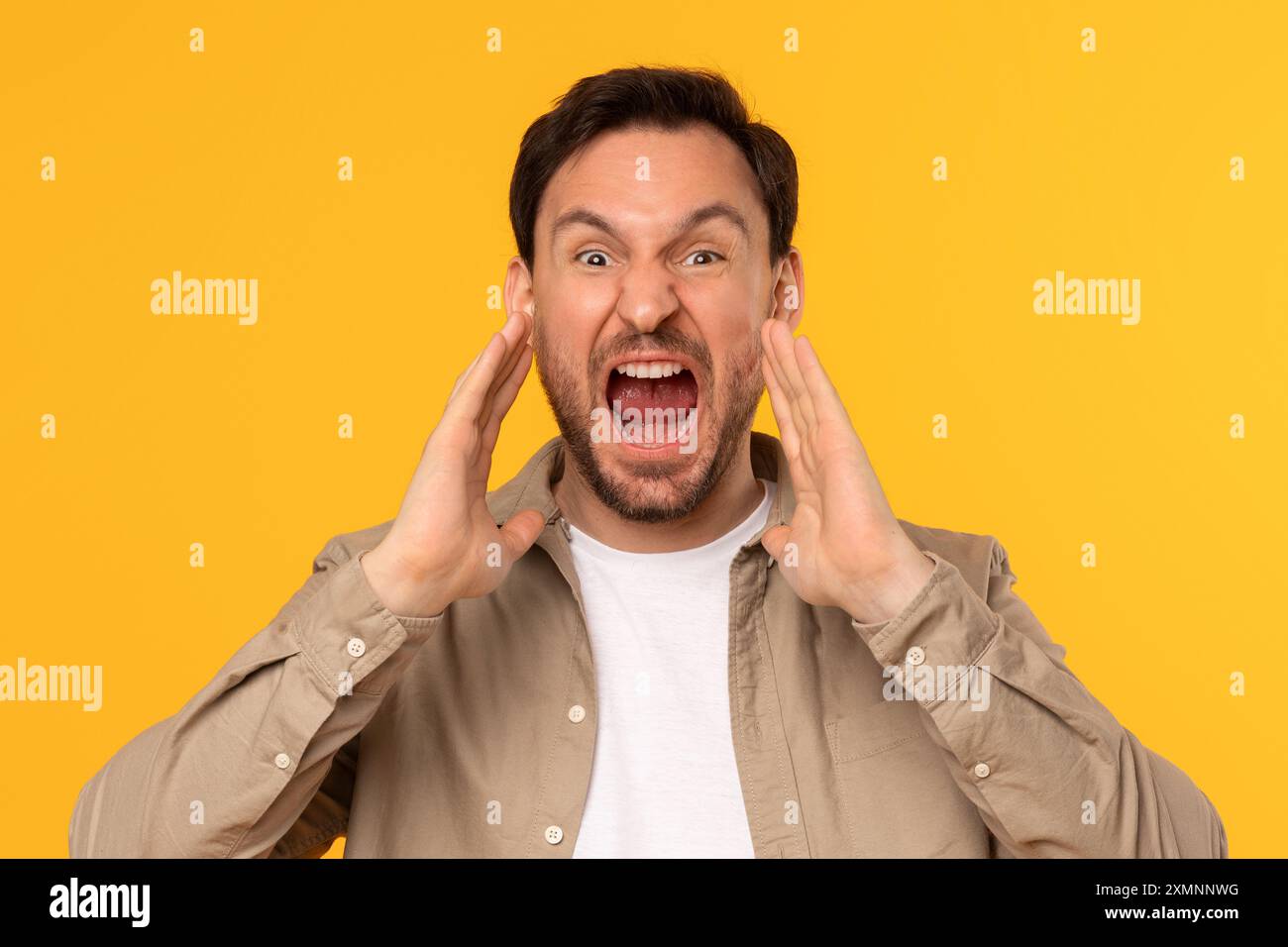 Man Shouting With Mouth Open and Hands Cupped Stock Photo - Alamy