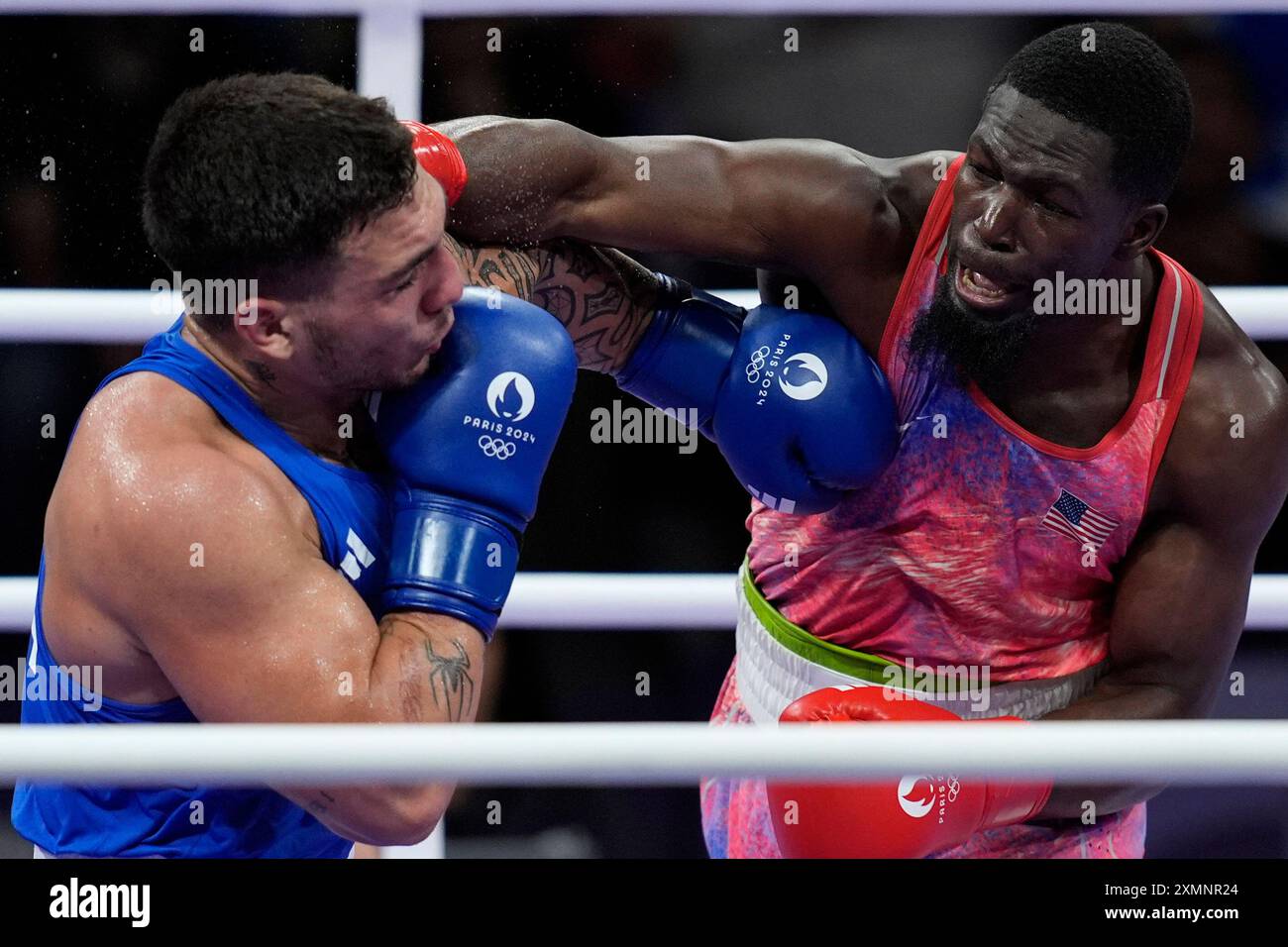 United States' Joshua Edwards hits Italy's Diego Lenzi in their men's ...