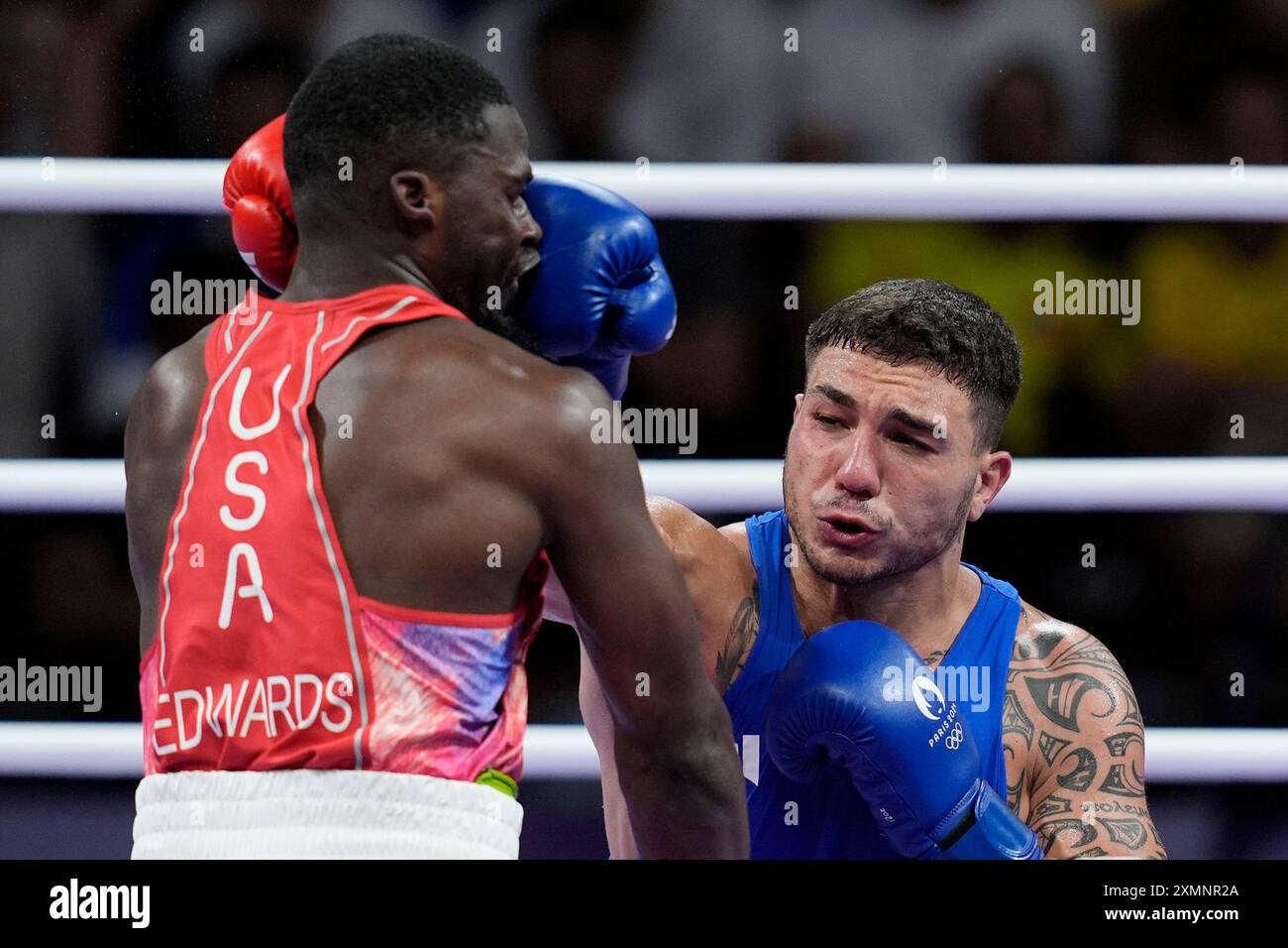 Italy's Diego Lenzi hits United States' Joshua Edwards in their men's ...
