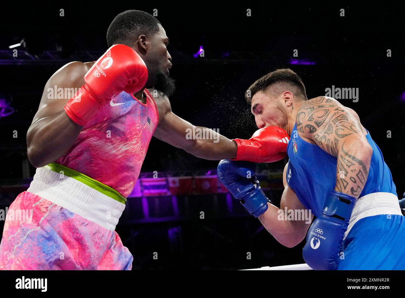 United States' Joshua Edwards hits Italy's Diego Lenzi in their men's ...